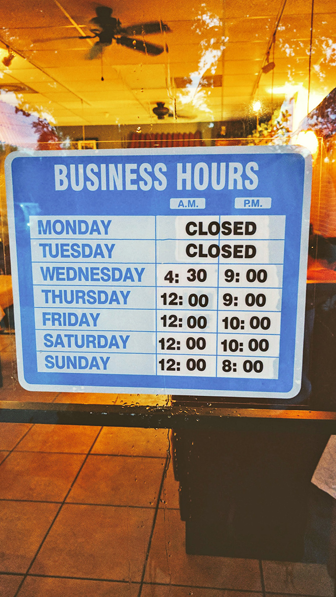 The business hours sign &ndash; a refreshingly honest schedule that says "we're closed when we need to be, because some things shouldn't be rushed."