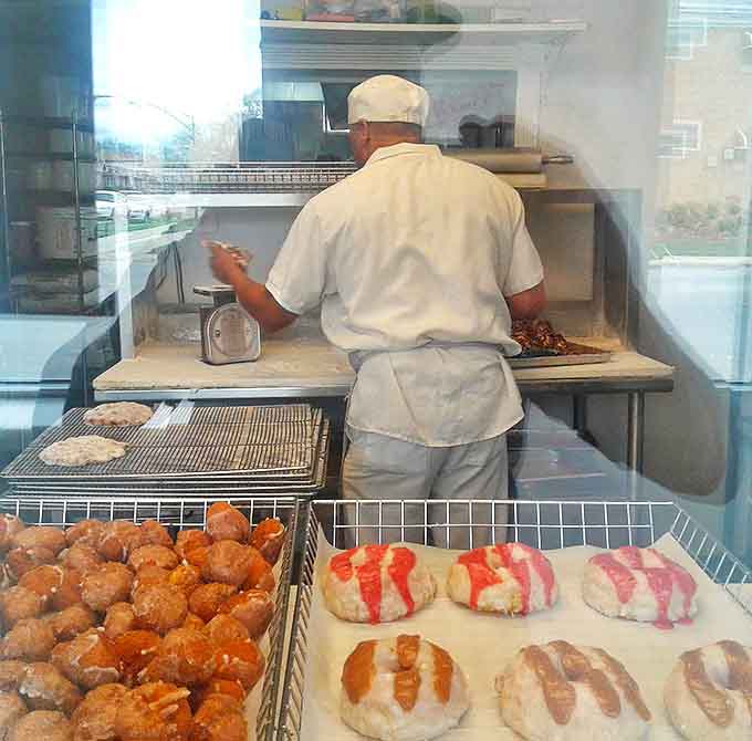 A glimpse into the kitchen where the magic happens&mdash;skilled hands crafting each donut with care and precision honed over years of practice.