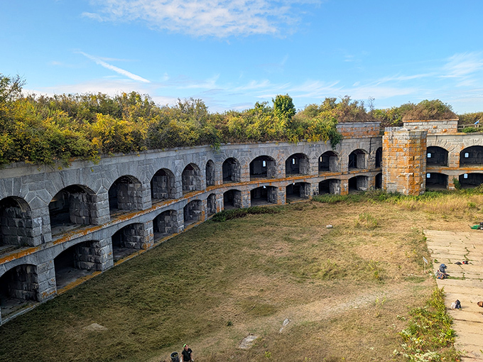The fort's multi-tiered casemates create a honeycomb of chambers, each designed to house cannons that never fired in battle.