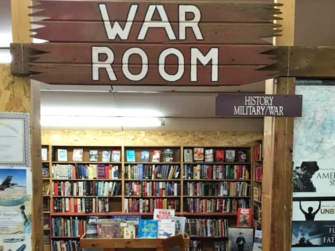 The "War Room" sign stands sentry over military histories, where battles past are preserved in pages that smell of time itself.