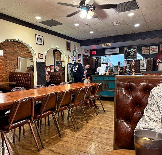 The dining area balances comfort with history &ndash; leather booths, wooden tables, and brick walls create an atmosphere where conversations flow as easily as the coffee.