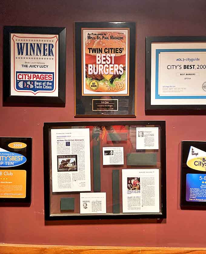 A wall of awards and accolades tells the story of consistent excellence &ndash; these aren't just decorations but testaments to decades of burger mastery.