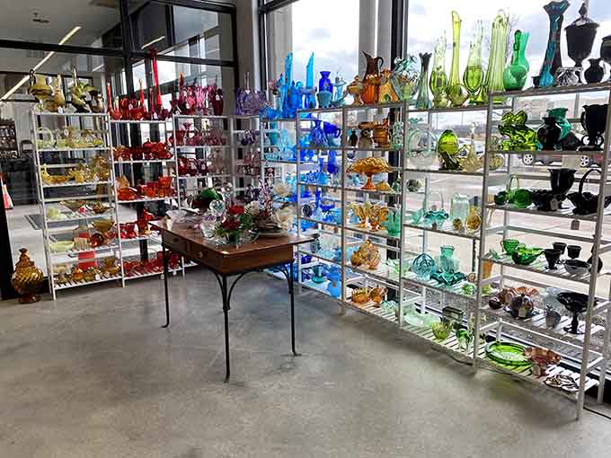 Rainbow arrays of vintage glassware catching light like edible jewels, each piece a small celebration of color and craft.