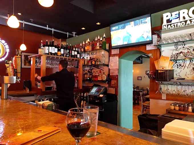 The bar area beckons with bottles and possibilities, ready to enhance your meal with the perfect pour.