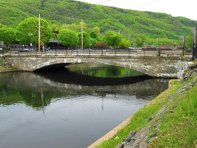 Engineering meets artistry in this arched bridge, where form and function create a pathway across waters that shaped the town's destiny.