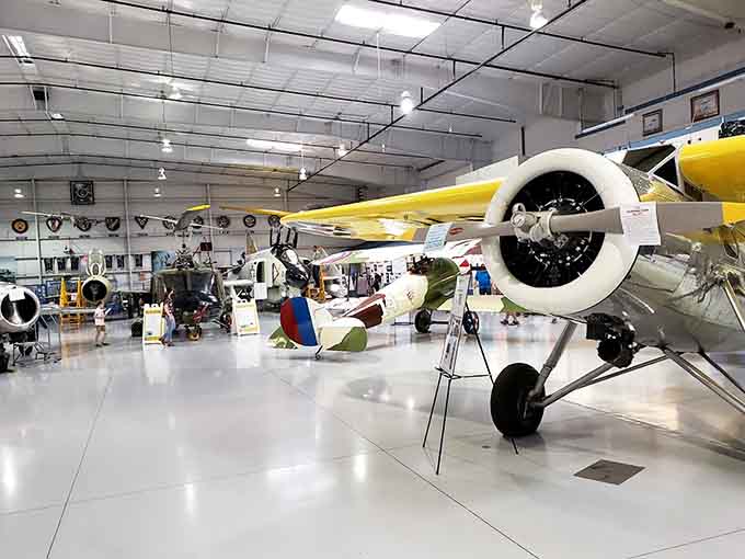 Row after row of meticulously restored warbirds create an indoor airfield that would make any aviation enthusiast weak in the knees.