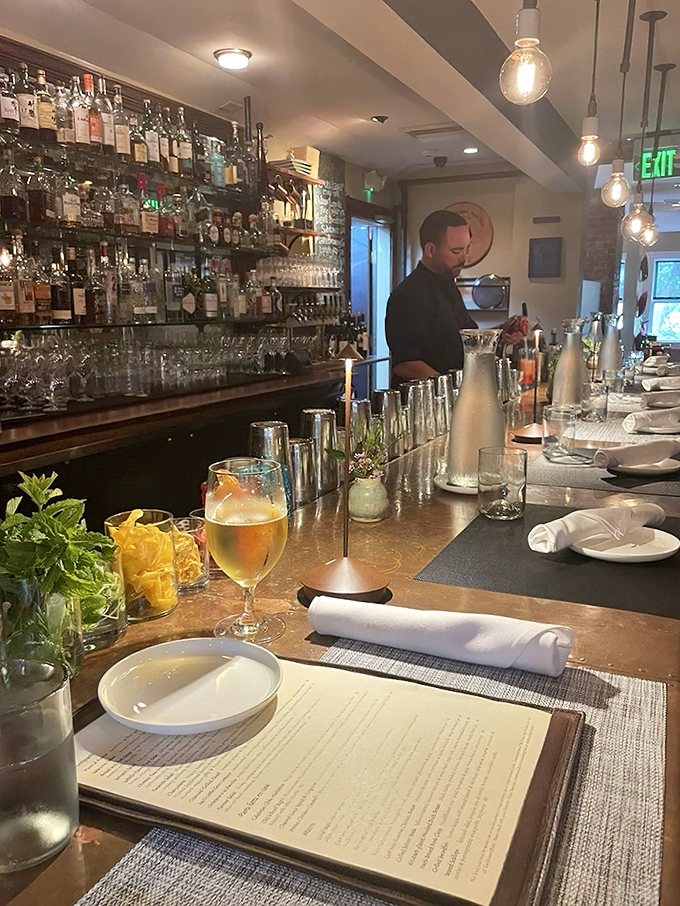 Primo's bar invites lingering over craft cocktails and small plates, a perfect perch for watching culinary magic unfold in real time.