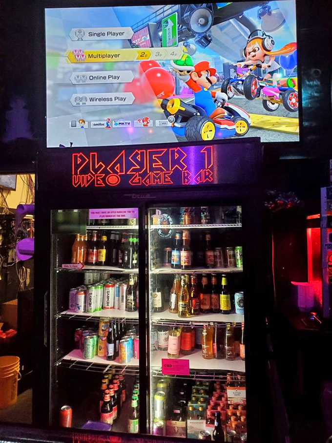 The well-stocked refrigerators behind the bar promise cold refreshment, while Mario Kart battles rage on the screens above.