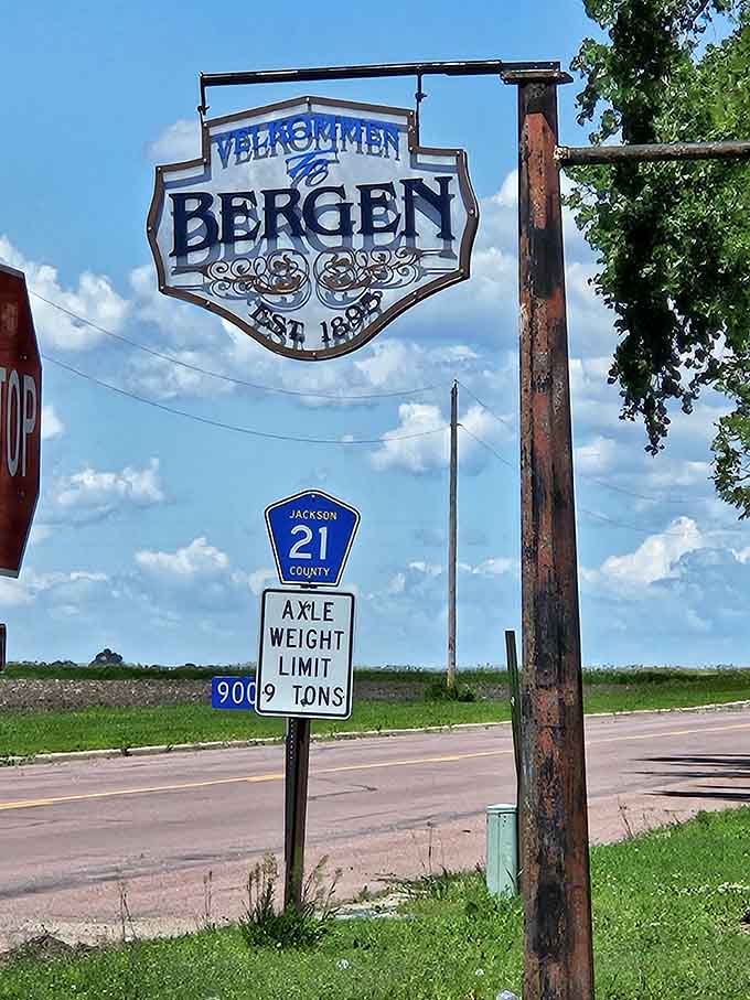 A sign marking the town that houses this culinary gem, where the axle weight limit matters less than the prime rib quality.