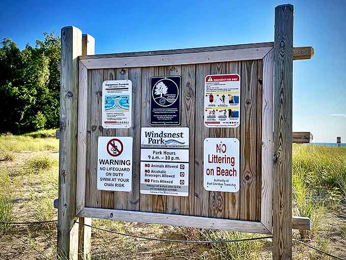 This informational board silently answers questions visitors haven't thought to ask yet, the unsung hero of beach day planning.