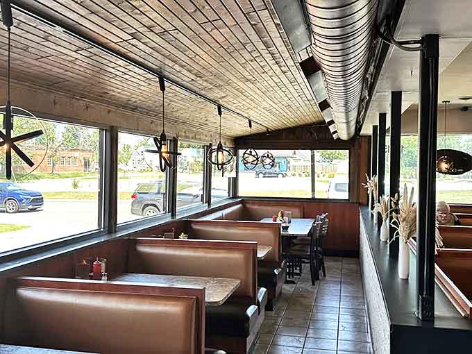 Cozy booths line the windows, offering the perfect perch for people-watching while you devour your meal.