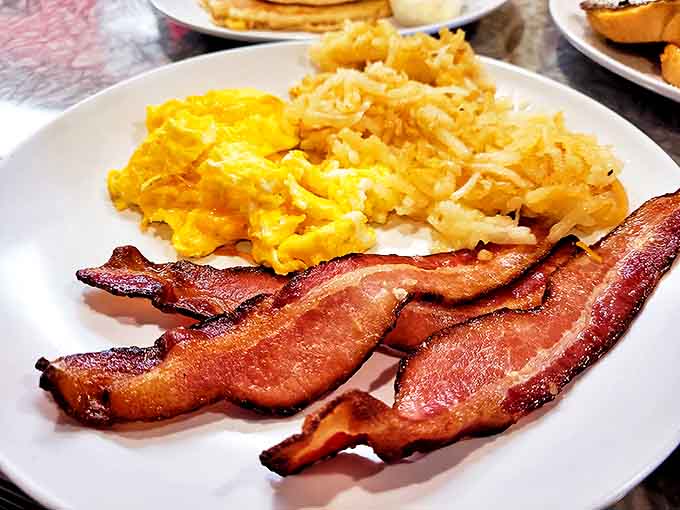 The breakfast trifecta &ndash; eggs, bacon, and hash browns in perfect harmony, like the Beatles of breakfast foods.