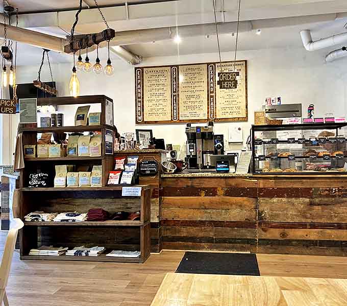 A counter built from reclaimed wood where countless coffee dreams have come true, one order at a time.