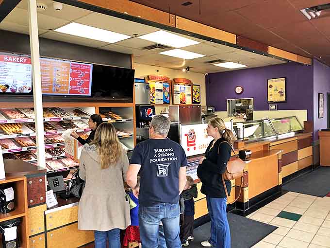 The morning ritual &ndash; customers contemplating life's most important decision: which delicious donut variety to choose today.