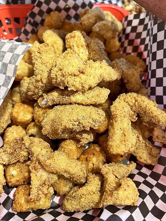 Crispy catfish bites with cornmeal coating &ndash; like Southern popcorn that disappears from the basket faster than you can say "more, please!"