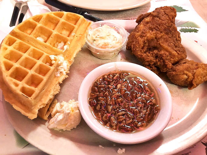Chicken and waffles with a side of coleslaw – because sometimes you need something green on your plate to maintain the illusion of balance.