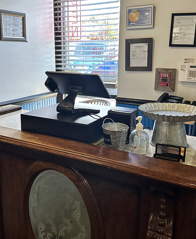 The check-in area showcases well-earned accolades – each framed review a testament to consistently exceeding the high expectations of hungry visitors.