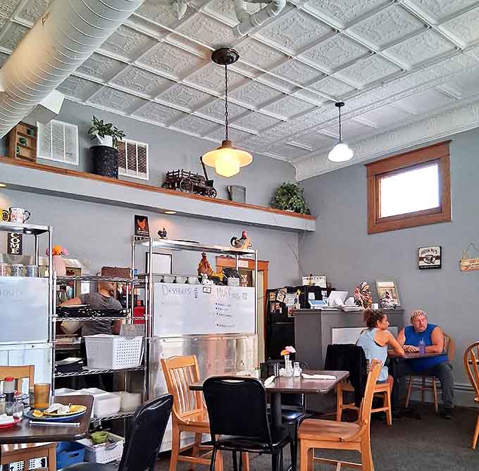 The counter area where staff move with easy familiarity, knowing most customers by name and remembering their usual orders.