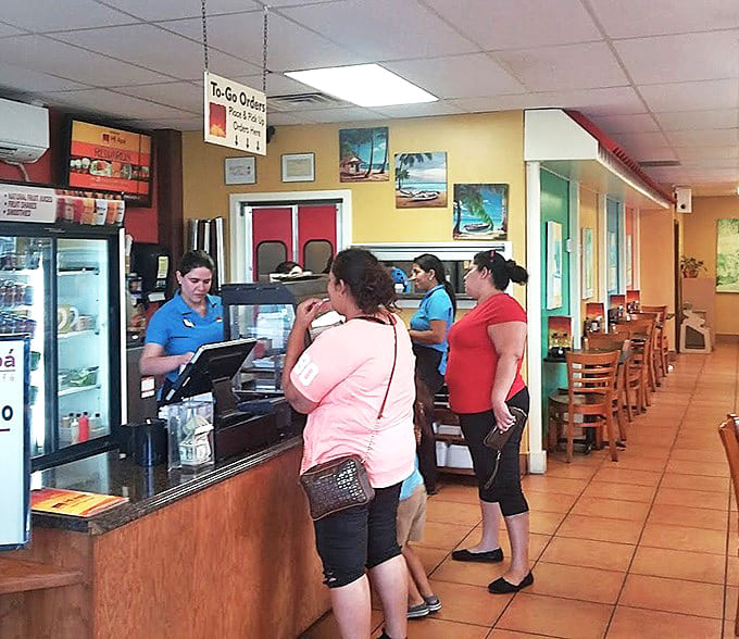 Where the magic happens &ndash; efficient staff members work their culinary choreography, turning out plate after plate of Cuban comfort food.