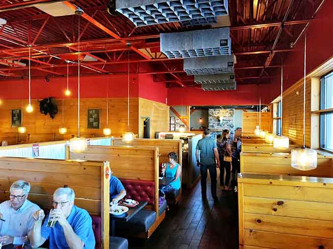 Happy diners fill wooden booths, creating the warm buzz of conversation that's as essential as the food itself.