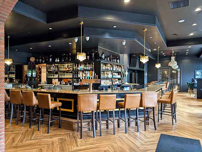 The well-stocked bar with comfortable seating invites you to settle in for a proper drink before or after your meal.