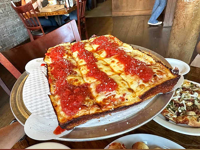 Detroit-style pizza done right &ndash; with those crispy, caramelized cheese edges that make you fight for the corner pieces every single time.