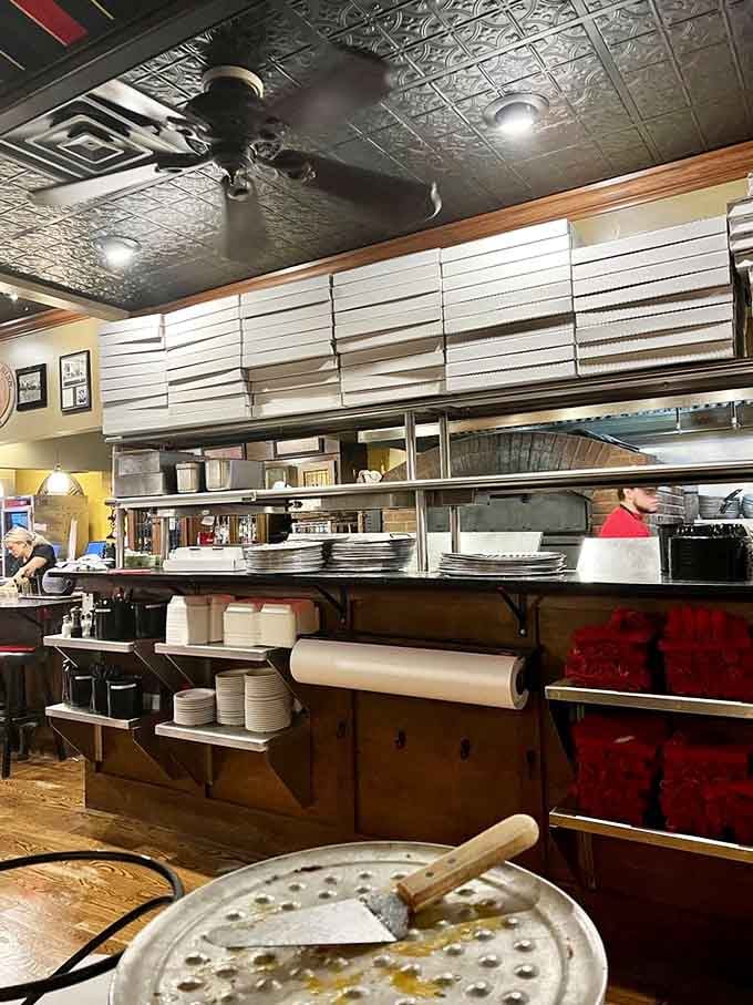 The open kitchen lets you watch pizza magic happen in real time, from dough tossing to oven sliding, like dinner theater but tastier.