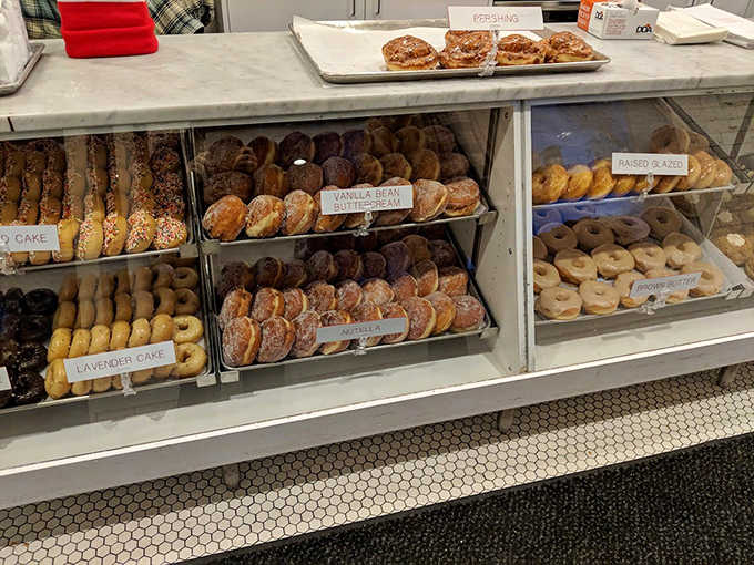 Decisions, decisions! The display case at Bogart's is like a museum of donut artistry, each variety more tempting than the last.