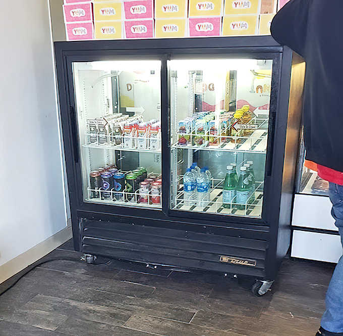 Beyond donuts: the drink cooler offers refreshing options to complement your sweet treats. Hydration is important, folks!