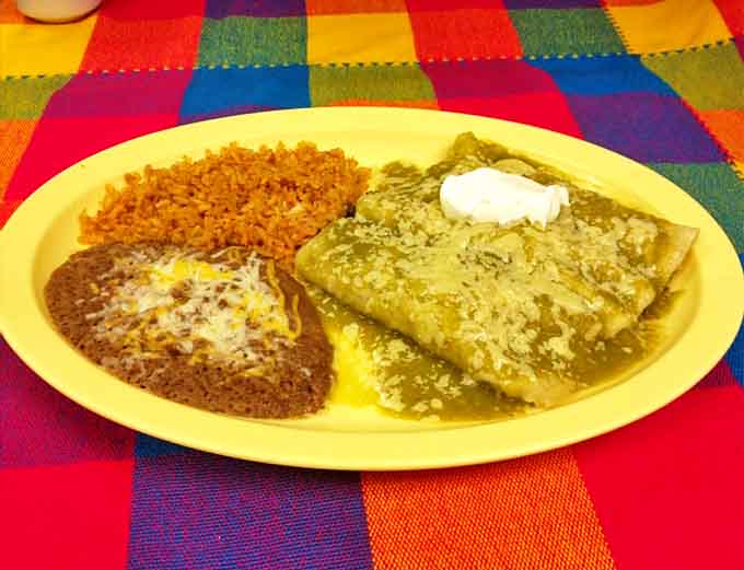 An enchilada dinner that comes with rice, beans, and the kind of satisfaction that makes you forget all your problems.