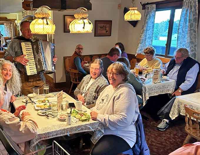 Live accordion music and happy diners create the kind of authentic atmosphere that makes every meal feel like a special occasion.