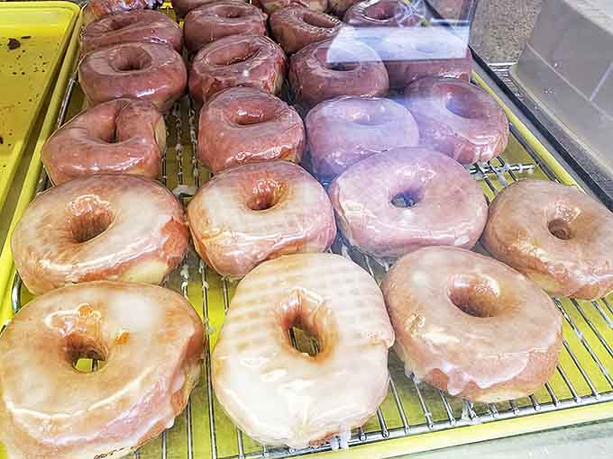 These glazed donuts glisten with promise, each one a perfect ring of happiness waiting to make your coffee jealous.