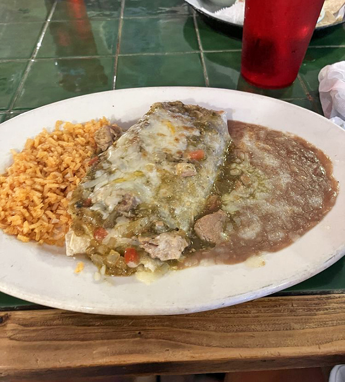 Green chile pork that makes you close your eyes with each bite &ndash; tender meat swimming in a sauce worth bottling and taking home.