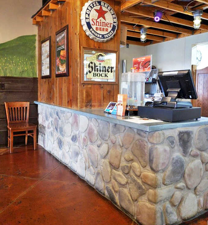 The gateway to barbecue bliss &ndash; Hickory River's stone-accented counter welcomes hungry visitors with Shiner Beer signs nodding to Texas roots.