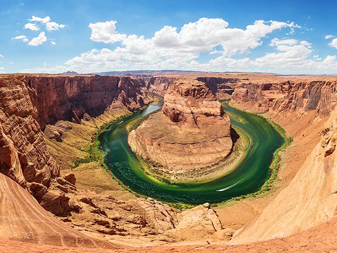 Horseshoe Bend reveals the Colorado River's artistic side, carving a perfect curve through ancient stone that photographers can't resist.