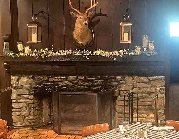 The stone fireplace creates a focal point in the dining room, where mounted wildlife reminds you this is definitely Michigan.