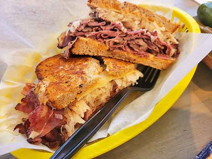 The architectural marvel of sandwiches &ndash; corned beef, sauerkraut, Swiss, and Russian dressing creating a symphony of flavors between grilled rye.