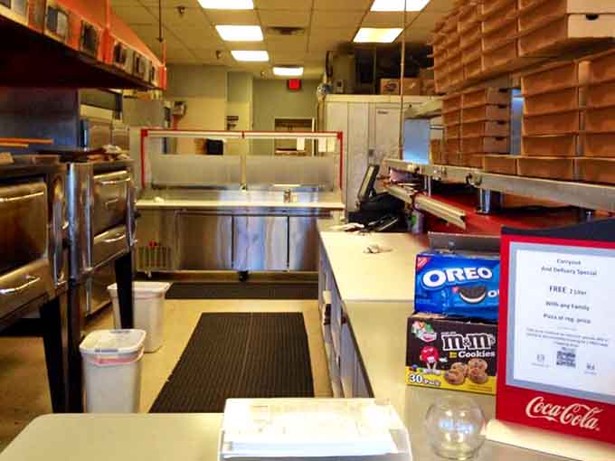 Behind the scenes, where the magic happens &ndash; traditional techniques meet fresh ingredients in this bustling kitchen space.