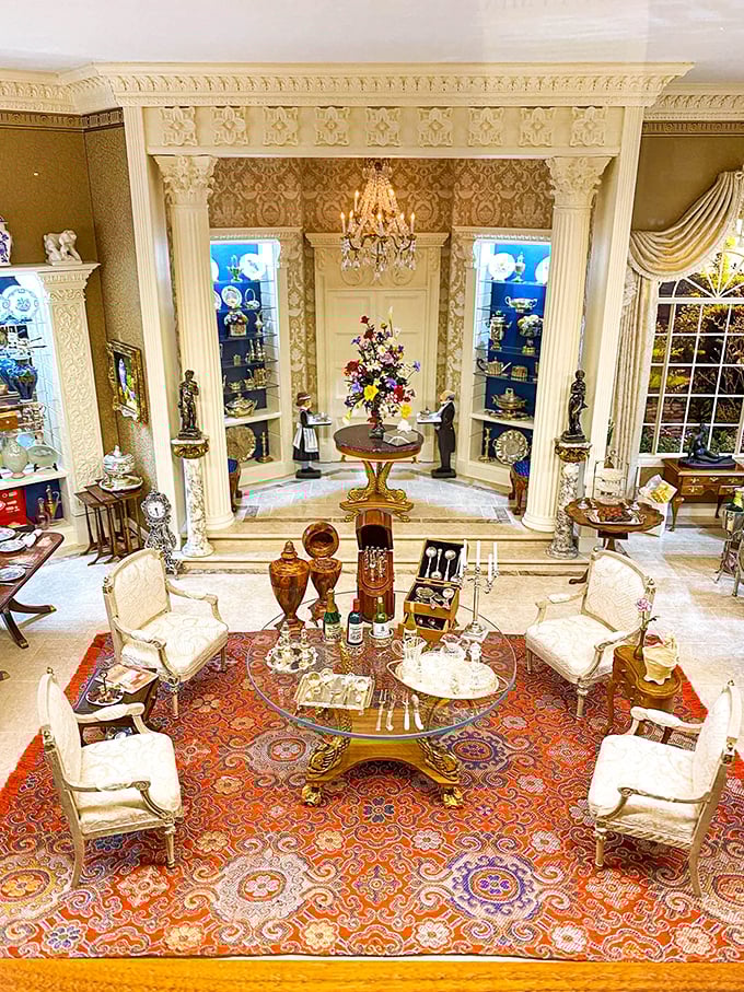 This elegant great room features a chandelier made of crystals smaller than salt grains, illuminating furniture that took longer to create than its full-sized counterparts.