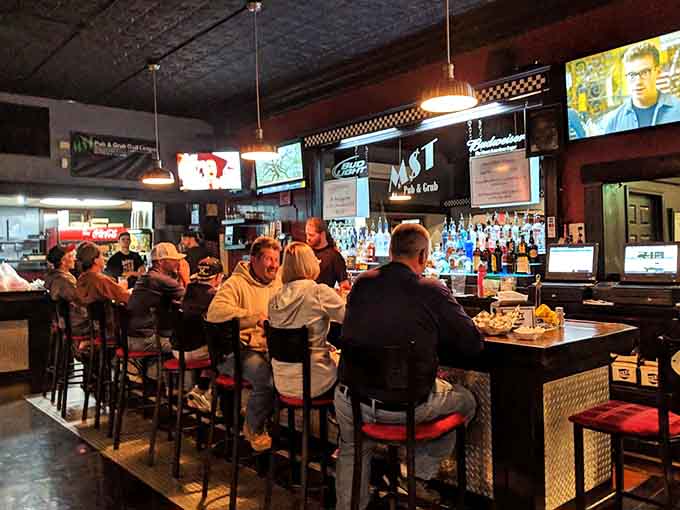 The well-stocked bar stands ready to complement your chicken adventure with the perfect beverage selection.