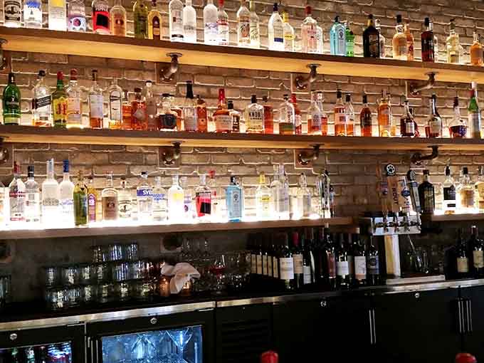 The bar's impressive bottle collection isn't just for show, it's the foundation for creative cocktails that balance innovation with drinkability.