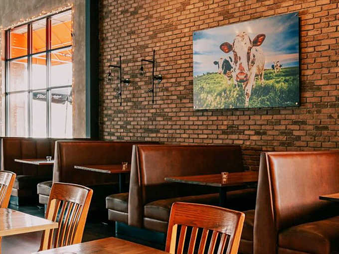 The restaurant's exterior features that iconic red tractor &ndash; a nod to the agricultural roots that inspire every dish on the menu.