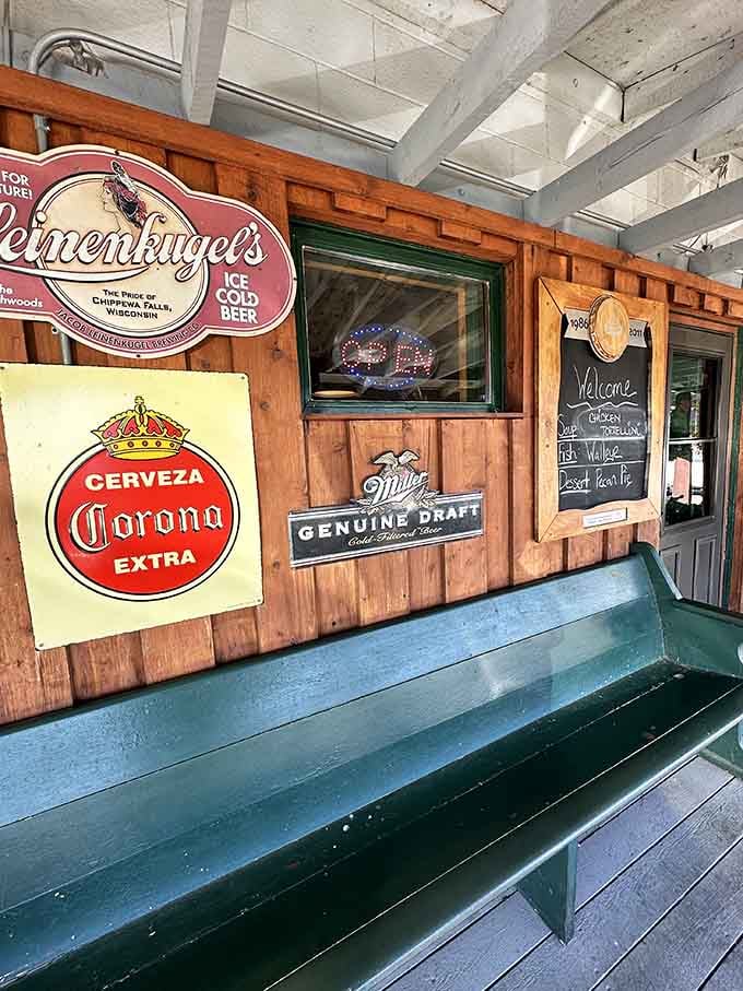 Vintage beer signs and a weathered bench set the tone before you even walk inside, promising authenticity and character.