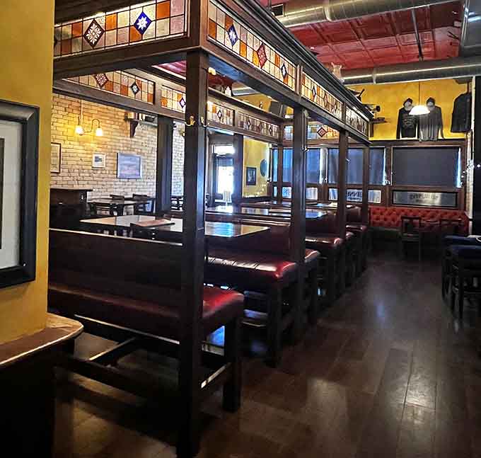 High-backed booths offer privacy without isolation, perfect for date nights or catching up with old friends over great food.