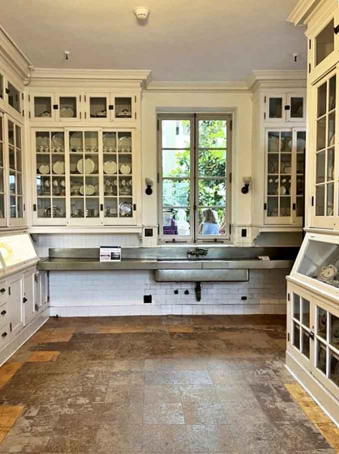 Behind the glamour, this pristine service area reveals the invisible machinery that powered Gilded Age entertaining with military precision.