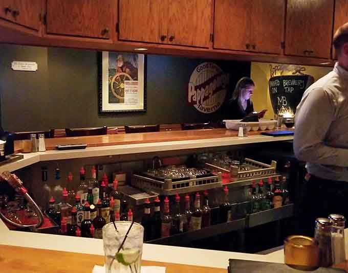 The bar area provides a cozy spot for pre-dinner drinks or a casual meal, with a selection that satisfies various tastes.