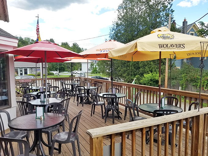 The inviting outdoor deck offers al fresco dining during warmer months &ndash; the perfect spot to enjoy a pint under Vermont skies.
