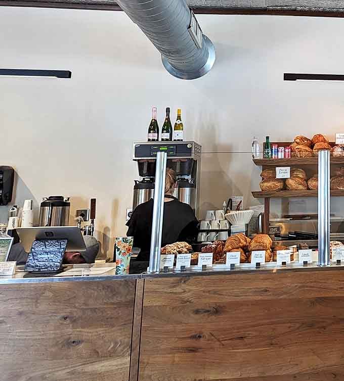 Behind this wooden counter, pastry magic happens daily&mdash;croissants and breads lined up like soldiers awaiting their marching orders.