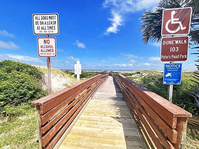 Peters Point Beachfront Park's boardwalk stretches toward the dunes like a wooden welcome mat to paradise, complete with benches for contemplating life's big questions.