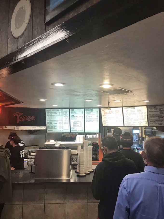 The counter area bustles with activity as staff efficiently prepare orders, turning quality ingredients into the comfort food dreams are made of.